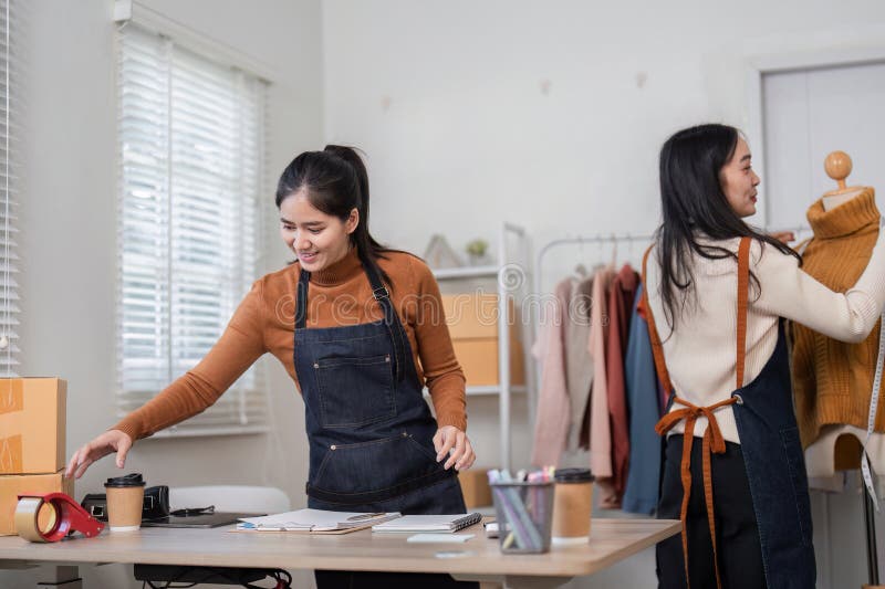 Fashion Designers Collaborating Creatively in a Modern Studio with ...