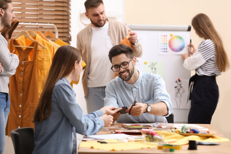 Fashion Designers Creating Clothes in Studio Stock Photo - Image of ...