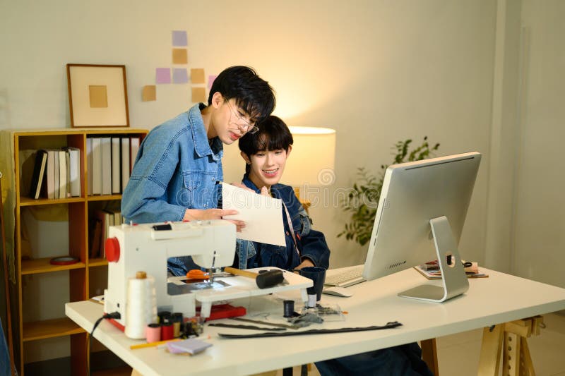 Fashion Designers Working on a Creative Project in Stylish Workspace ...