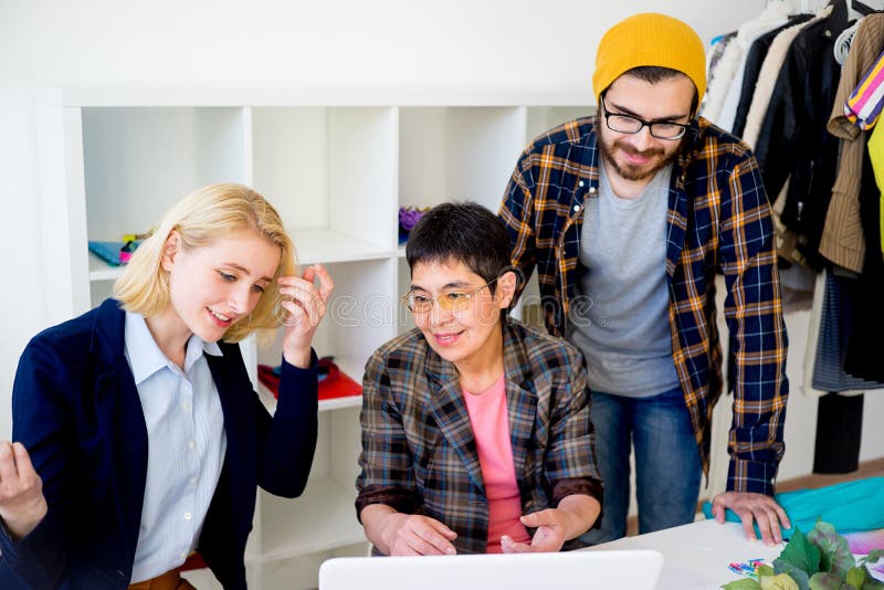 Fashion designers working stock photo. Image of table - 97730732