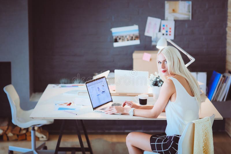 Fashion Designers Working in Studio Sitting on the Desk. Stock Photo ...