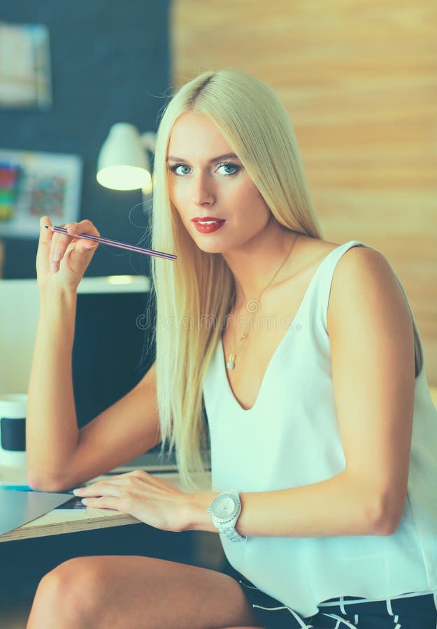 Fashion Designers Working in Studio Sitting on the Desk Stock Image ...