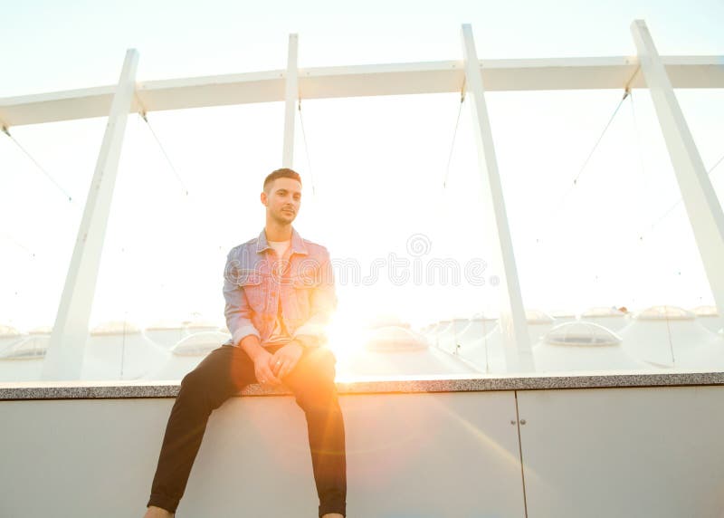 Fashion Guy Sitting at Sunset Posing Stock Image - Image of concept ...