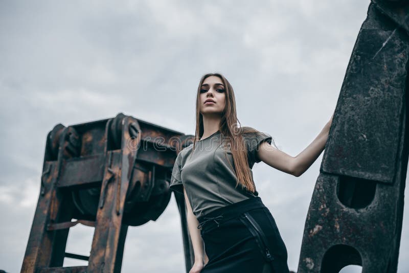 Fashion Lonely Girl In Motion Posing On City Of Urban Background Stock