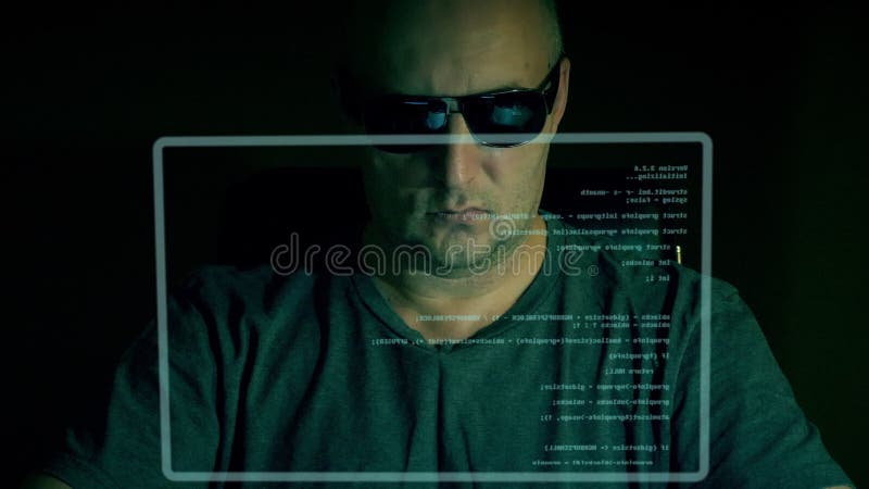 Fashion Man in Dark Glasses Sits in Front of Virtual Screen and Typing ...