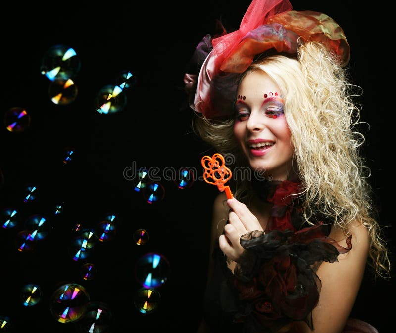 Fashion Model with Creative Make-up Blowing Soap Bubbles Stock Photo ...