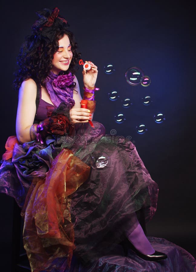 Fashion Model with Creative Make-up Blowing Soap Bubbles. Stock Photo ...