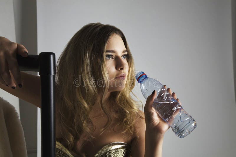 Fashion Model Drinking Water from Bottle in Studio Stock Image - Image ...