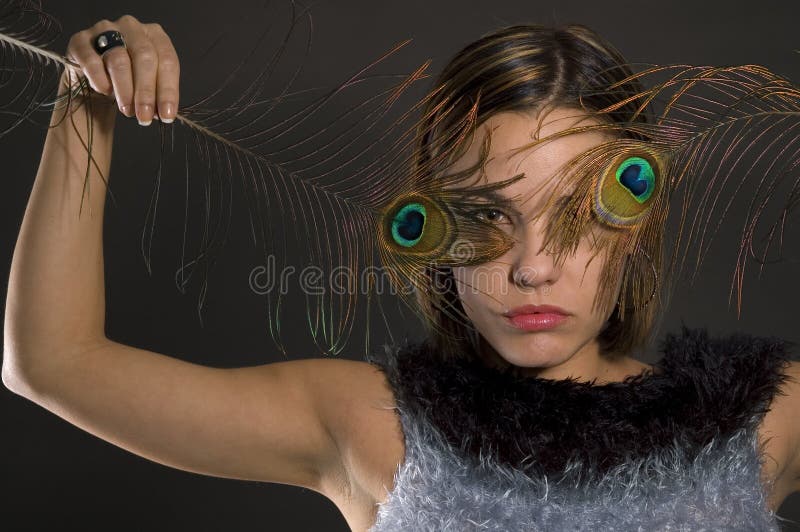 Fashion model with feather stock image. Image of luxury - 4754497