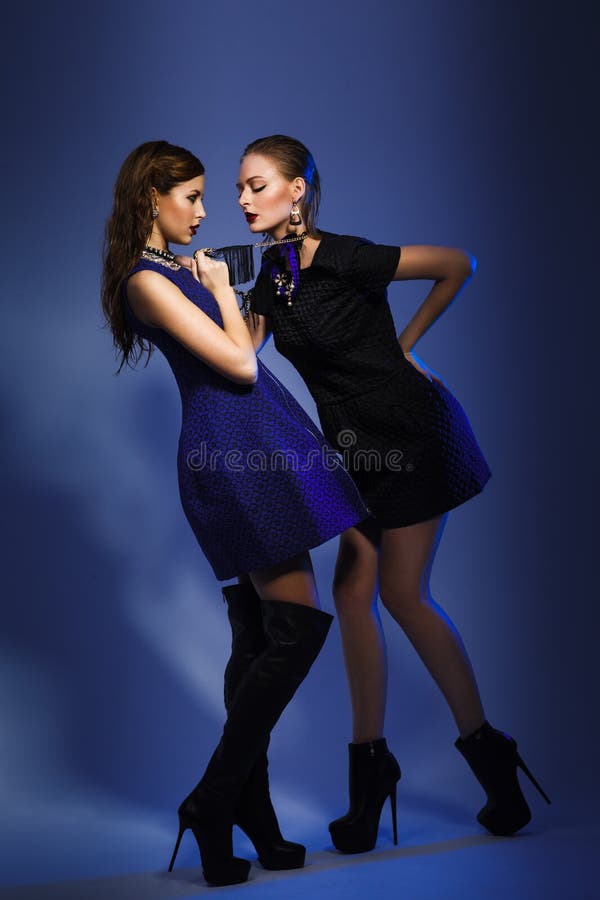 Fashion Models Posing in Blue Background Stock Image - Image of studio ...