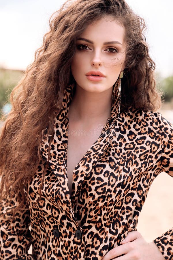 Beautiful Girl With Dark Curly Hair In Elegant Dress Stock Image