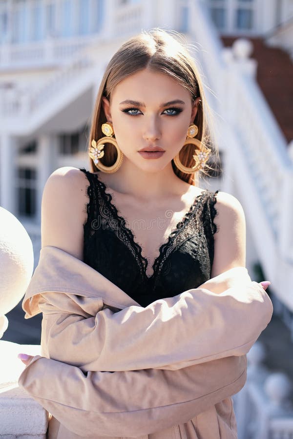 Beautiful Woman with Blond Hair in Elegant Outfit Walking by the Spring ... Beautiful Woman with Blond Hair in Elegant Outfit Walking by the Spring ...