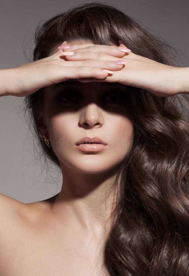 Portrait Of A Beautiful Brunette Woman With Long Straight Hair Stock