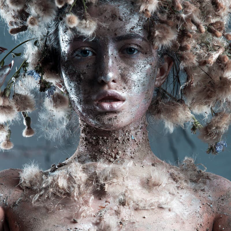 Fashion Portrait Of A Dark Skinned Girl With Silver Foil Make Up