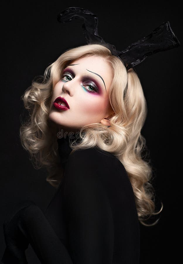 Fashion Portrait of Model with Creative Make Up Posing in Studio Stock ...