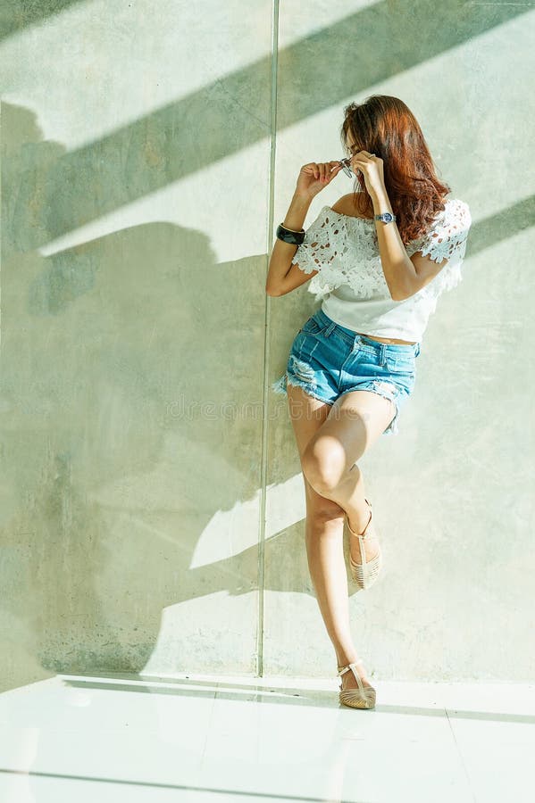 Fashion Portrait of Young Model Posing by the Wall Stock Photo - Image ...