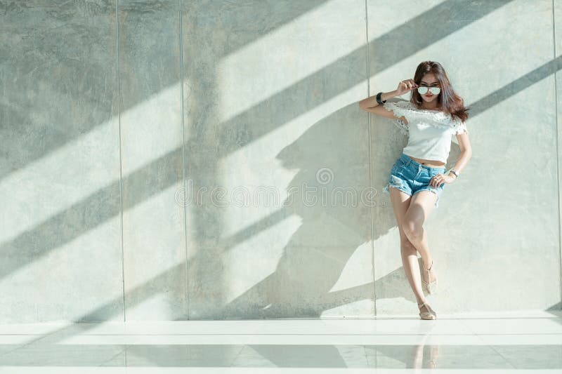 Fashion Portrait of Young Model Posing by the Wall Stock Image - Image ...