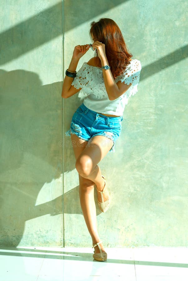 Fashion Portrait of Young Model Posing by the Wall Stock Image - Image ...