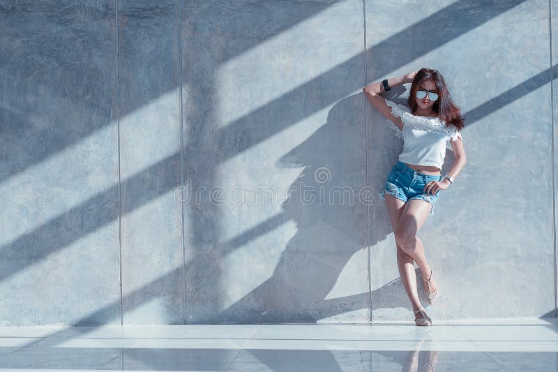 Fashion Portrait of Young Model Posing by the Wall Stock Image - Image ...