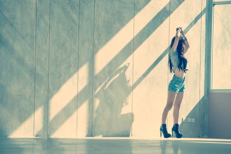 Fashion Portrait of Young Model Posing by the Wall Stock Photo - Image ...