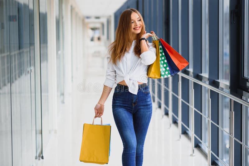 Fashion Shopping Girl Portrait. Beauty Woman with Shopping Bags in ... Fashion Shopping Girl Portrait. Beauty Woman with Shopping Bags in ...