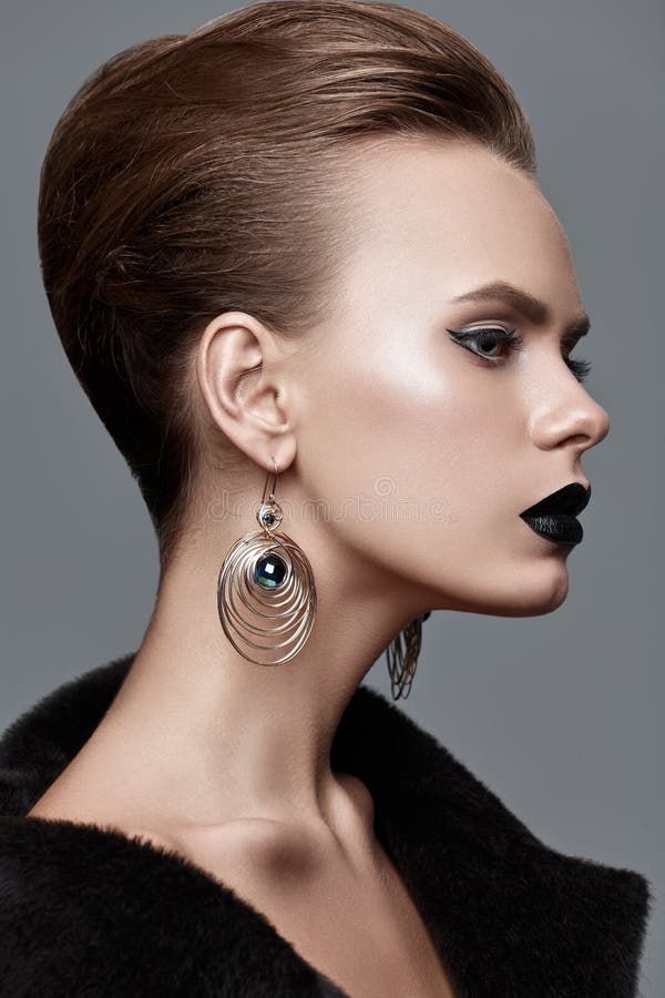 Fashion Style Model in Black Coat and Art Accessories, Posing in Stock ...