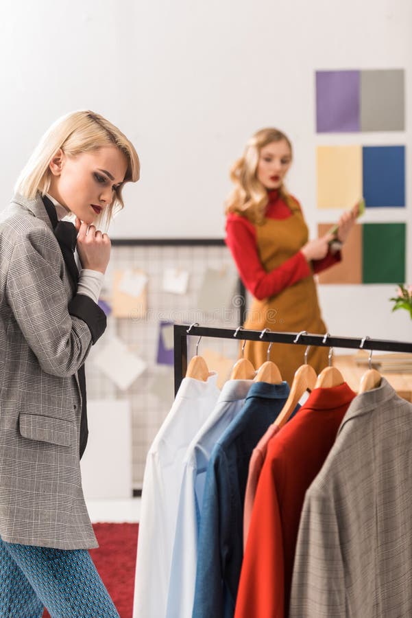 Fashionable Magazine Editor Working with Clothes in Modern Stock Photo ...