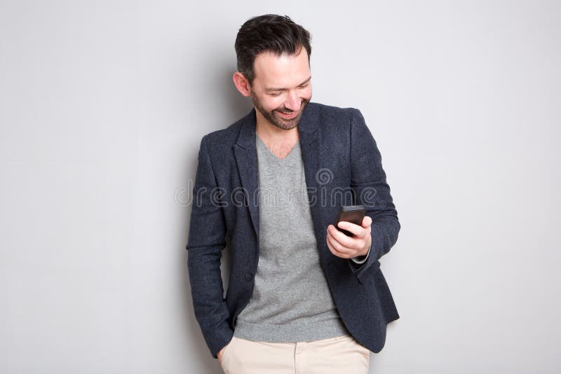 Fashionable Man Looking at Cellphone Stock Photo - Image of cellphone ...