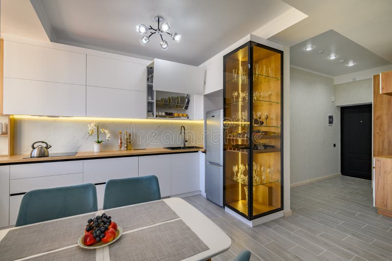 A Fashionable White Studio with a Modern Kitchen Stock Image - Image of ...