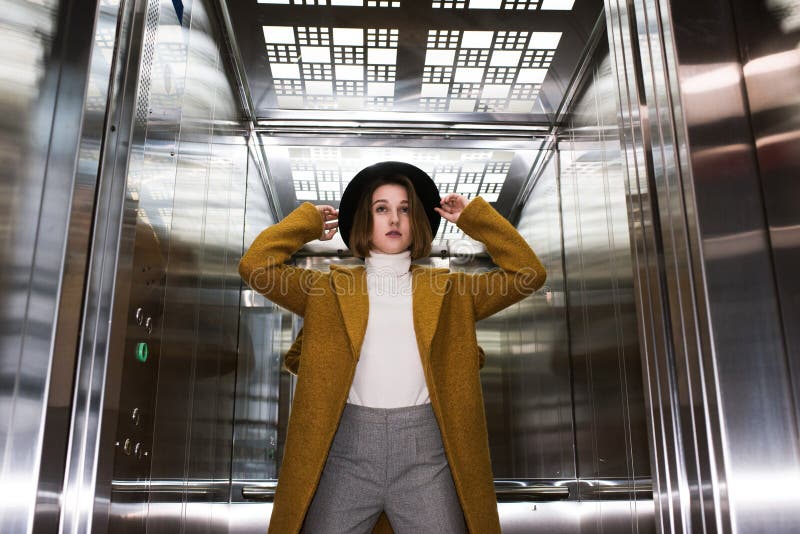 Fashionable Woman in Elevator Stock Image - Image of fashionable ...