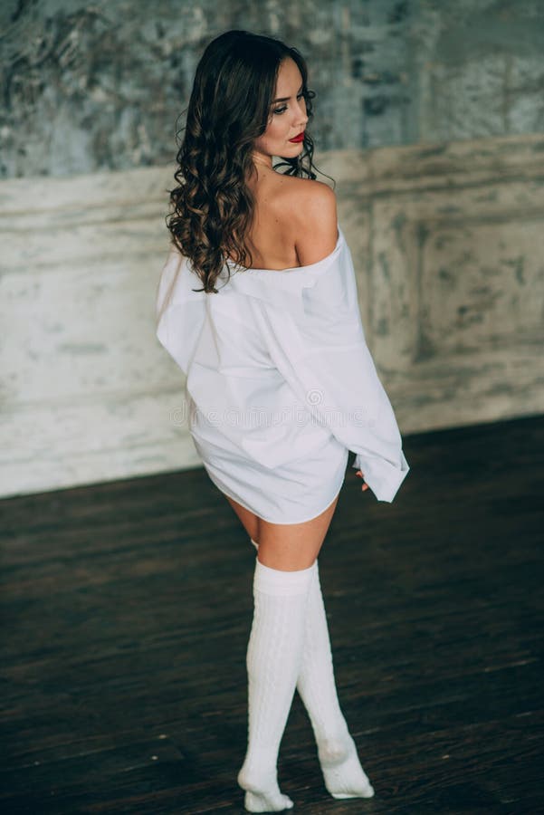 Fashionable Young Woman With Perfect Dark Curly Hair And Beautiful Make