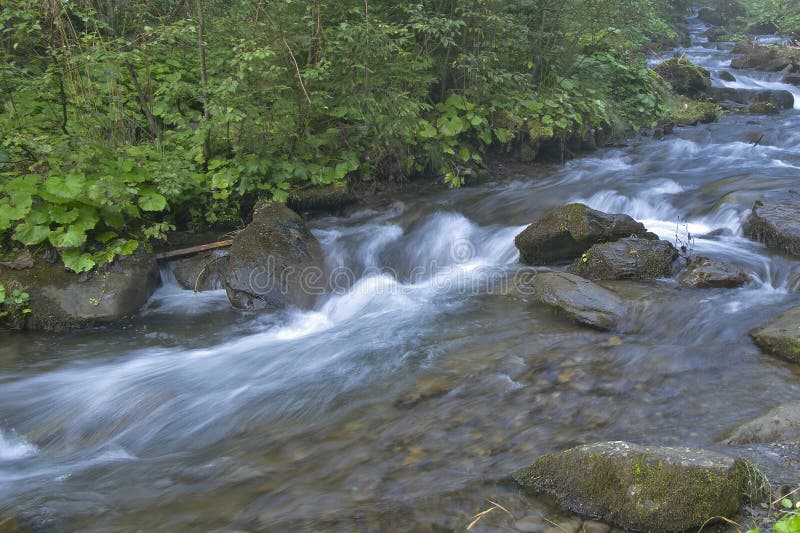 Fast Mountain River is Running between Huge Rocky Stones Stock Photo ...