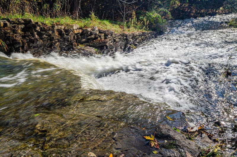 Fast Flowing Stream Falls Along a Walled Stream Stock Photo - Image of ...