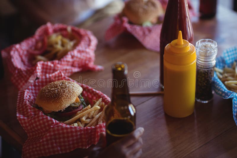 Fast Food and Beer Bottle on Table Stock Image - Image of unhealthy ...