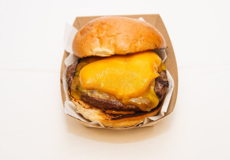 Fast Food Cheeseburger in Cardboard Container Stock Photo - Image of ...