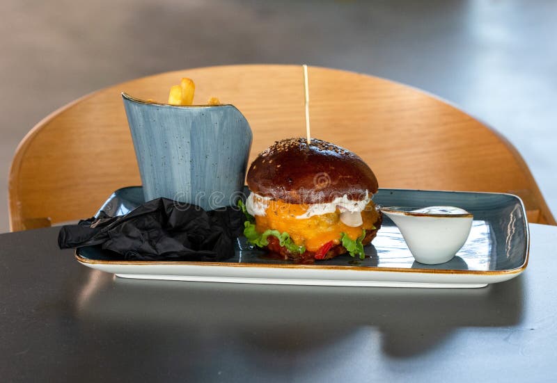 Fast Food Order of a Cheeseburger and Fries Served on Table Stock Image ...