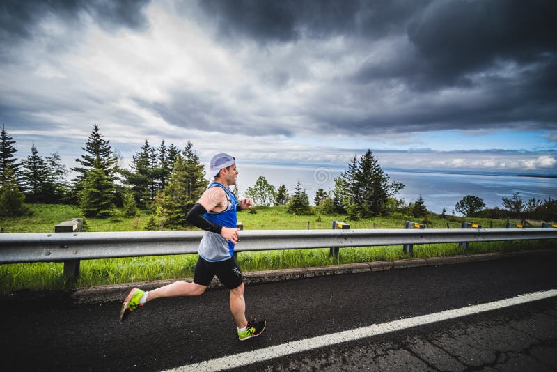 Fast Marathoner Alone Going Down the Hill Editorial Stock Photo - Image ...