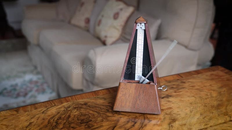 Fast Metronome on Top of a Walnut Veneer Table in a Drawing Room Stock ...