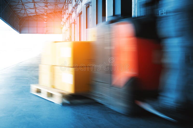 Fast Motion of Forklift Loading a Package Boxes in Warehouse. Forklift ...