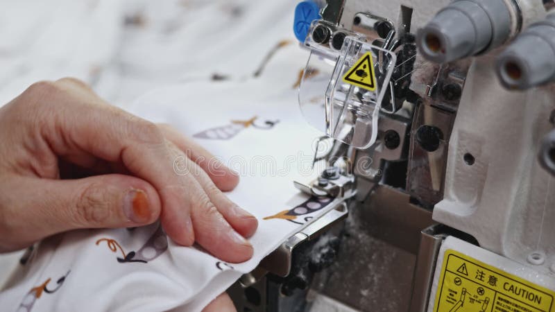 Fast Movement of the Sewing Machine Needle on the White Fabric. Media ...