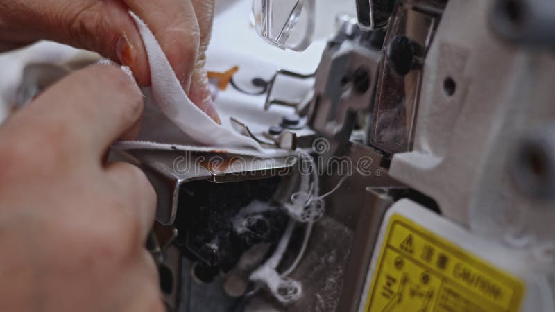 Fast Movement of the Sewing Machine Needle on the White Fabric. Media ...