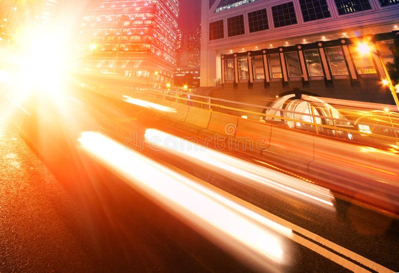 Fast moving cars at night stock photo. Image of landmark - 12679574
