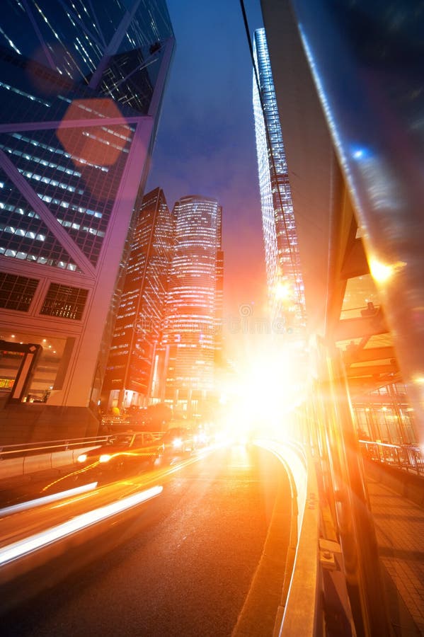 Fast moving cars at night stock photo. Image of building - 12679598