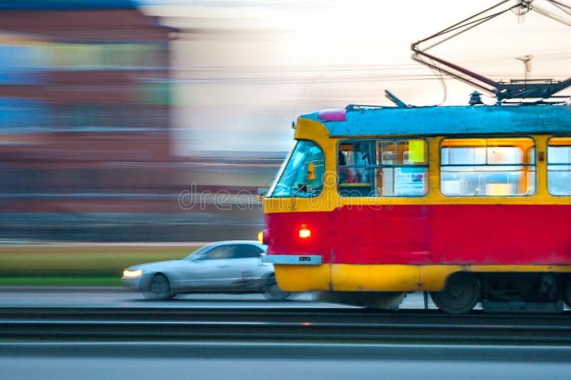 Fast Moving Red and Yellow Tram in the City with Lights on Stock Image ...