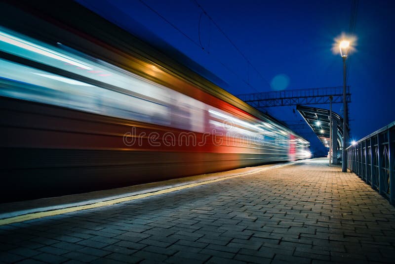 Fast moving train at night stock photo. Image of transportation - 182452304