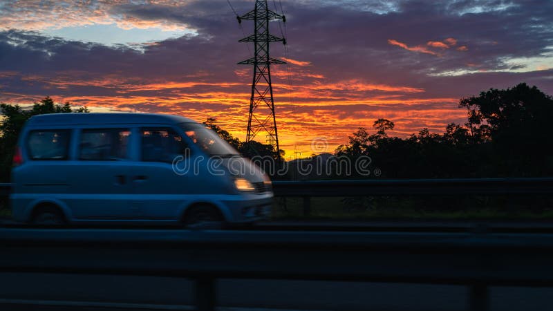 Fast Moving Van in Expressway Early in the Morning Against Bright ...