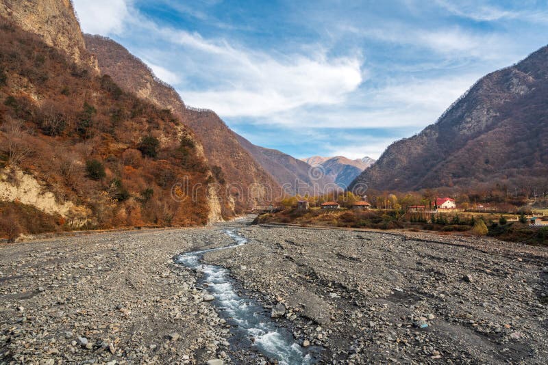 Fast River Flows between the Mountains at Autumn Season, Wide Angle ...