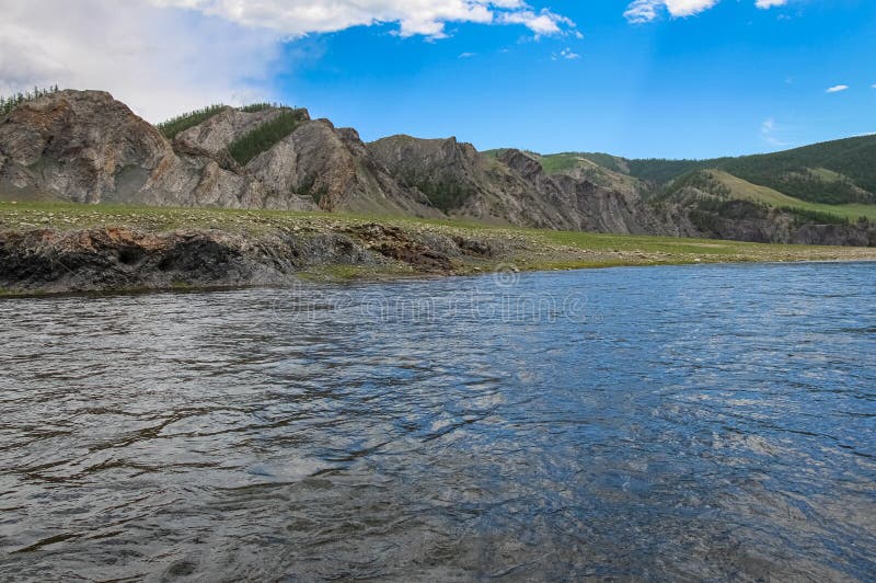 A Fast River in Mongolia, with Mountains and Blue Sky Stock Photo ...