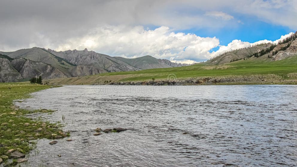 A Fast River in Mongolia, with Mountains and Blue Sky Stock Image ...