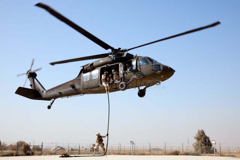 Fast rope from a Blackhawk editorial photography. Image of exercise ...
